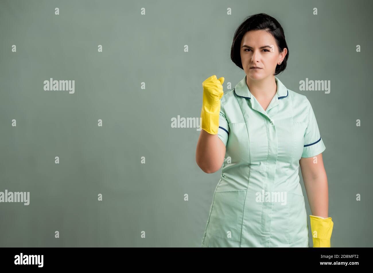 Young woman is showing a fist hi-res stock photography and images - Alamy