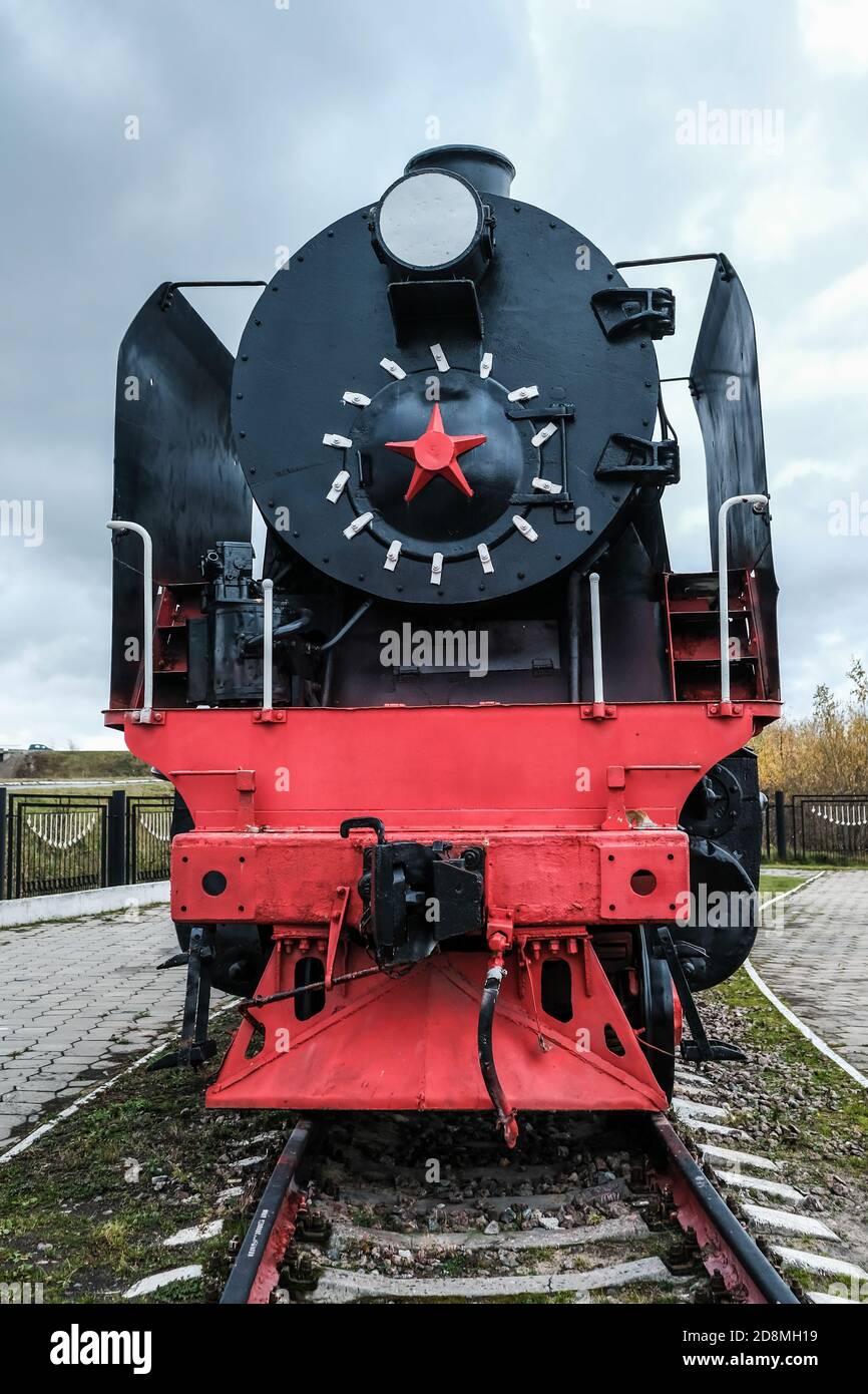 Old Russian locomotive. Steam locomotive with red wheels. Retro ...