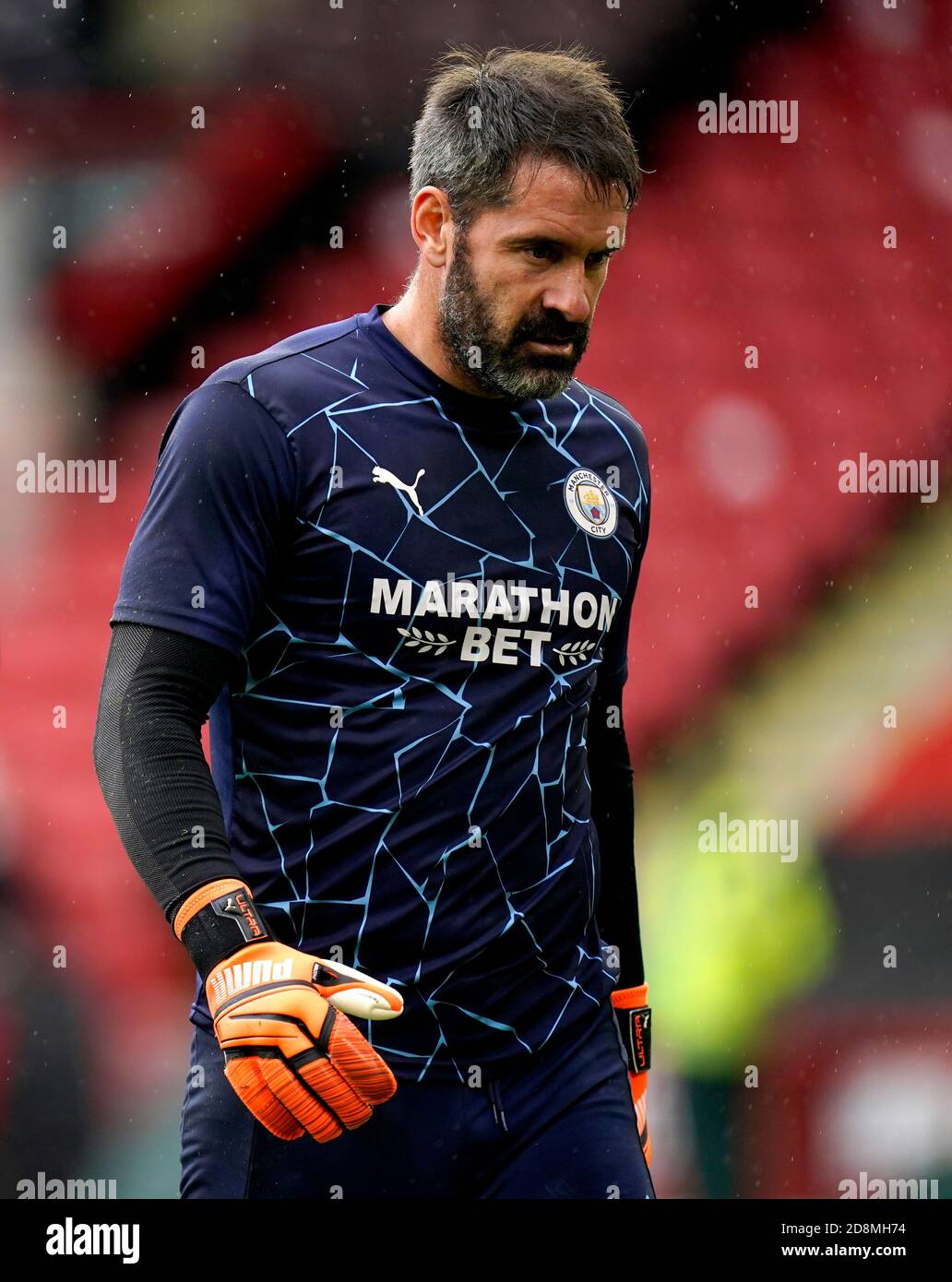 Manchester City goalkeeper Scott Carson walks off the pitch after ...