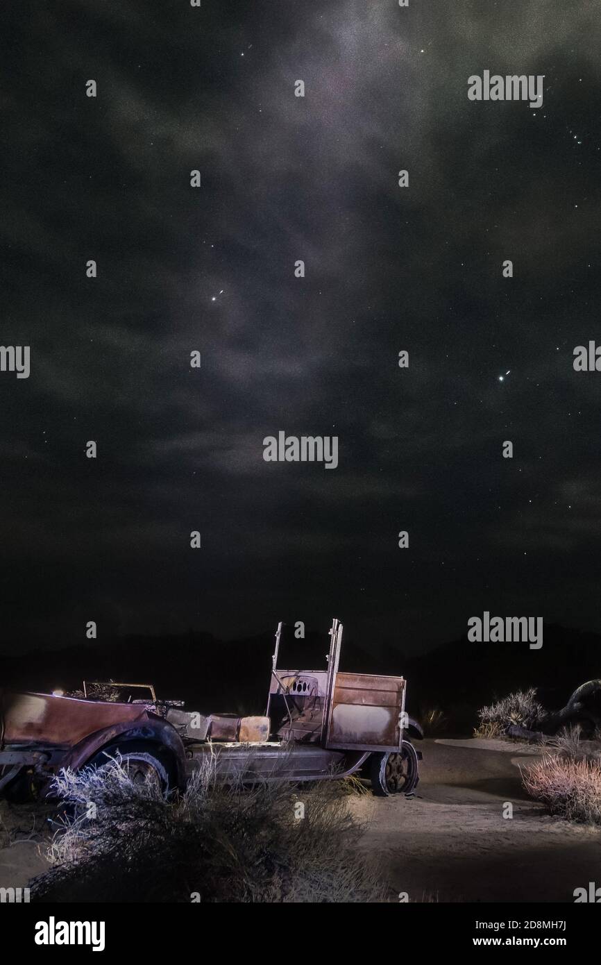 Old wrecked car at night in Joshua Tree National Park USA Stock Photo ...