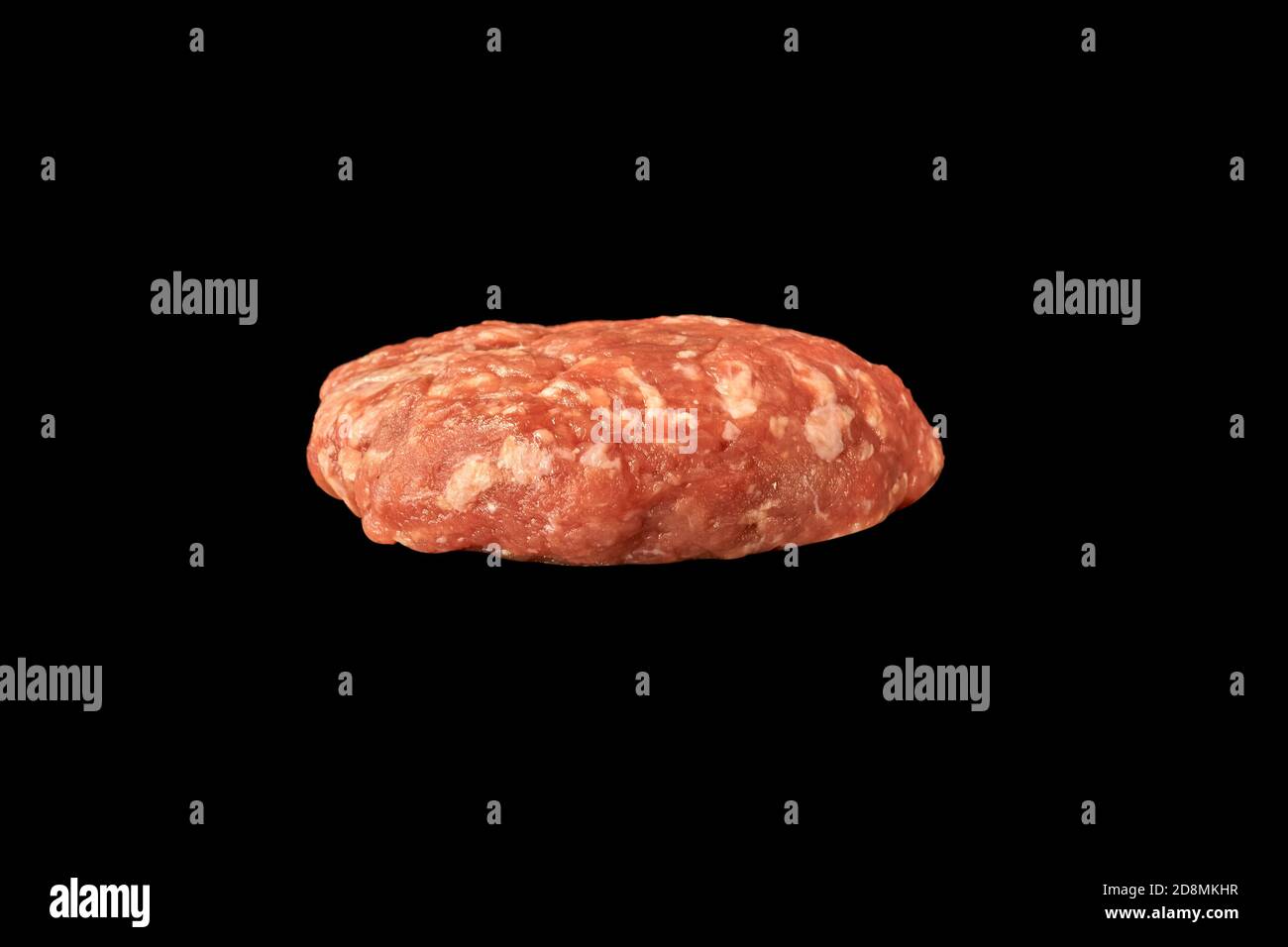 Raw uncooked meat cutlet isolated on black background burger ingredient ...