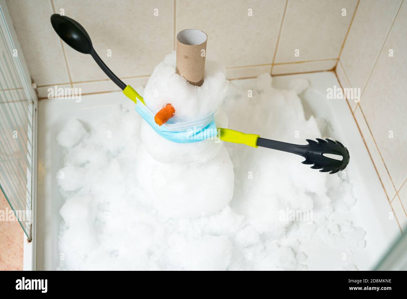 Small snowman built inside a shower with cutlery for hands Stock Photo ...