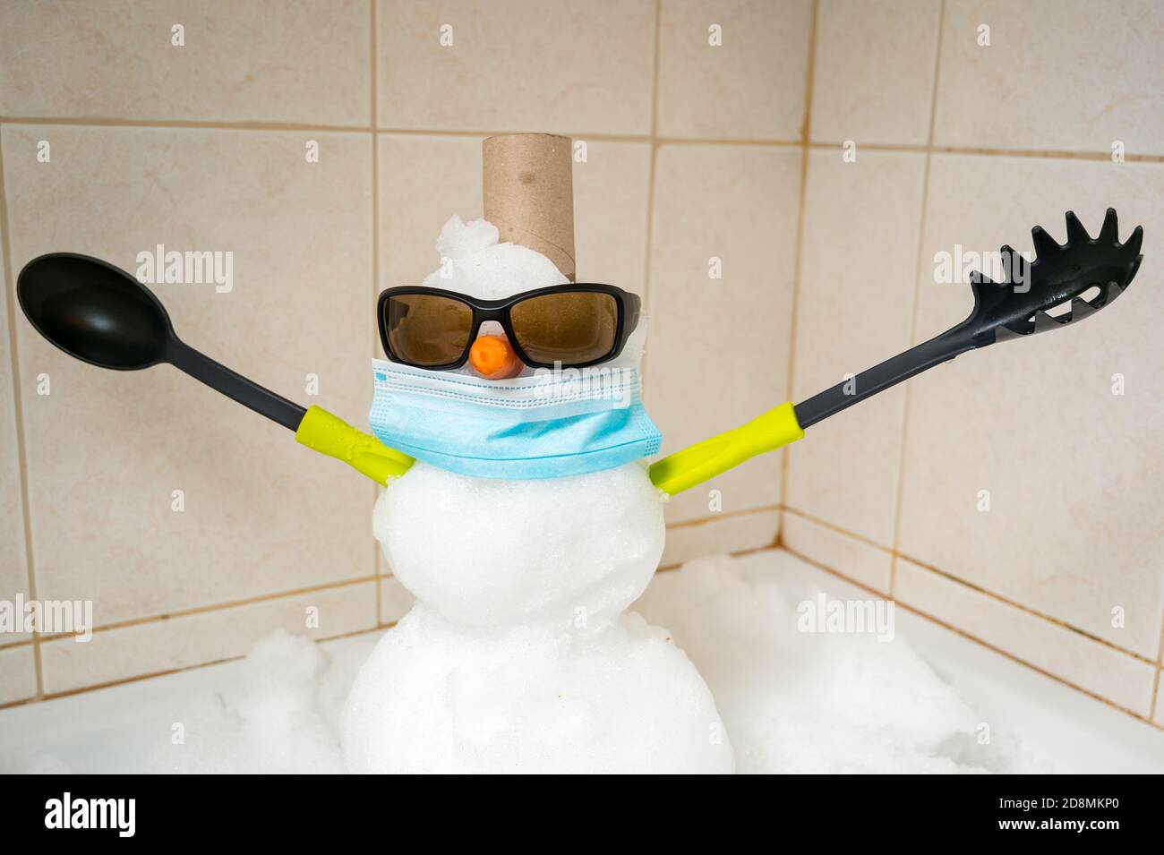 Small snowman built inside a shower with cutlery for hands Stock Photo ...