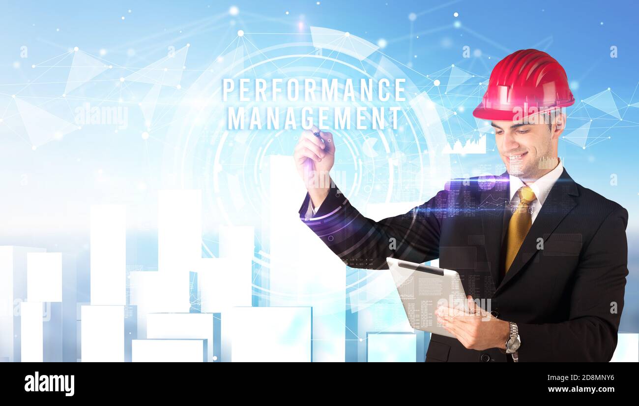 Handsome businessman with helmet drawing PERFORMANCE MANAGEMENT ...