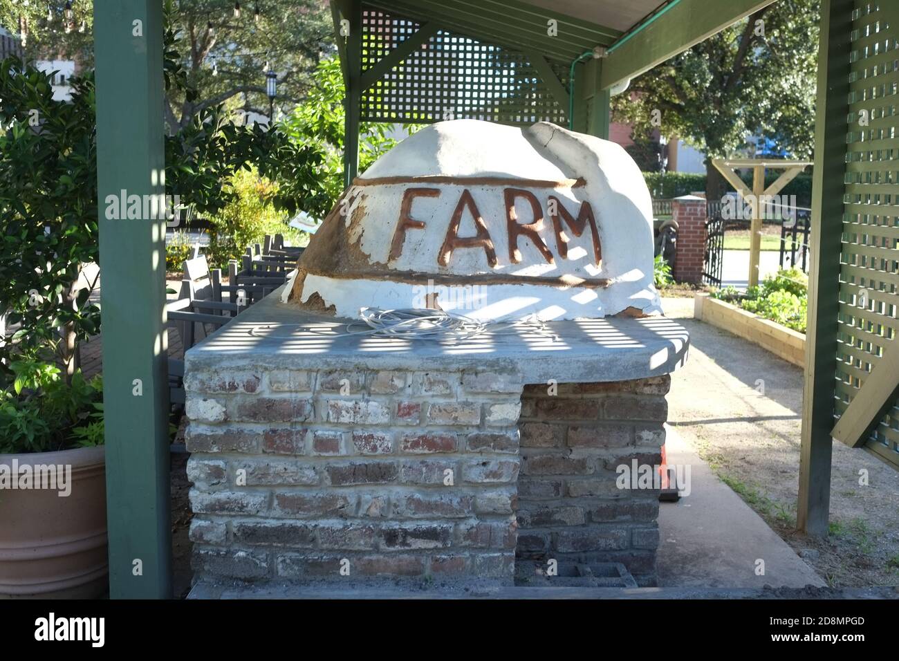 Urban Gardens with Crops of Vegetables, an Urban Farm, Oven and Chairs ...