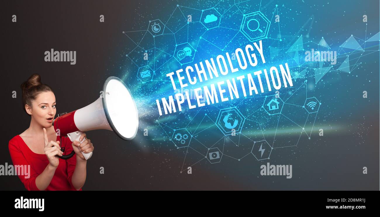 Young woman shouting in megaphone with TECHNOLOGY IMPLEMENTATION ...