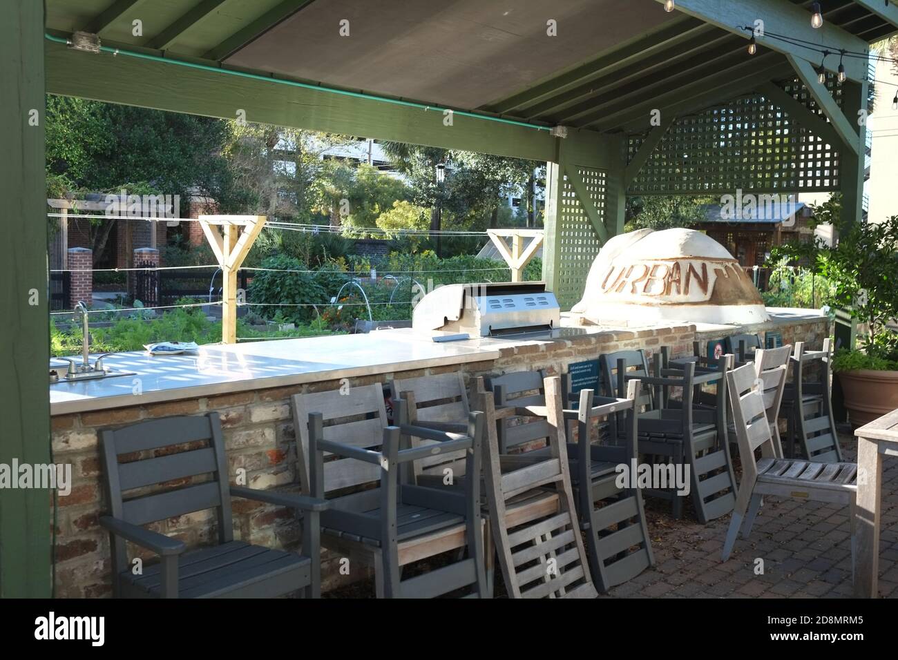 Urban Gardens with Crops of Vegetables, an Urban Farm, Oven and Chairs ...