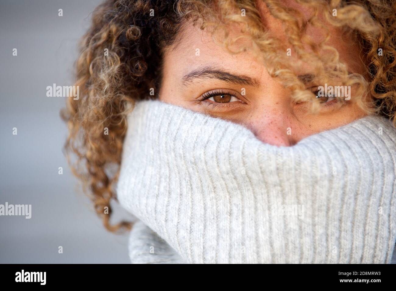 Woman covered face sweater hi-res stock photography and images - Alamy