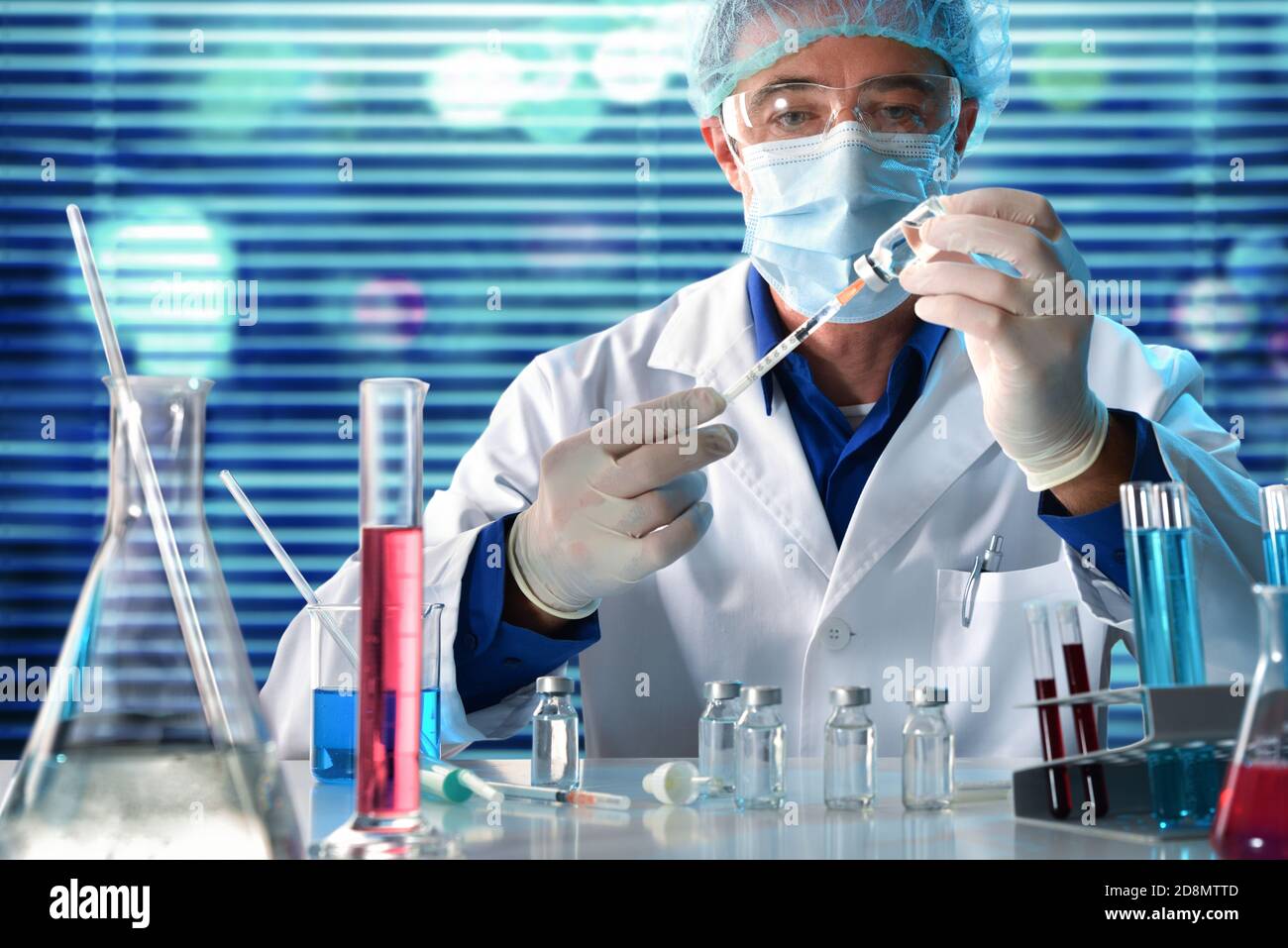 Virologist Filling A Syringe Researching Vaccine In Laboratory Bench