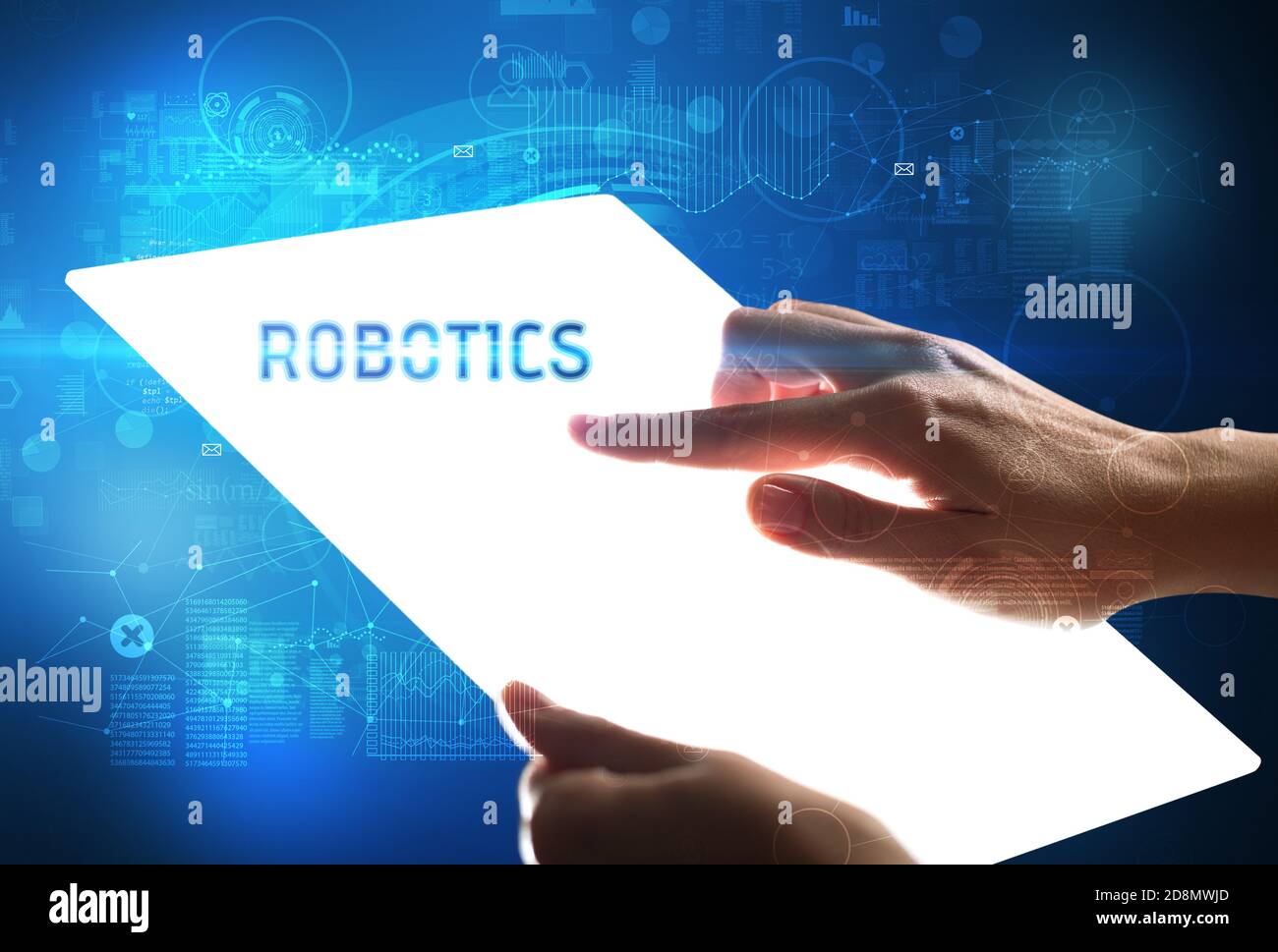 Hand holdig futuristic tablet with ROBOTICS inscription, new technology ...