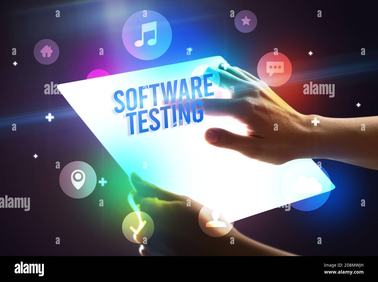Holding futuristic tablet with SOFTWARE TESTING inscription, new ...