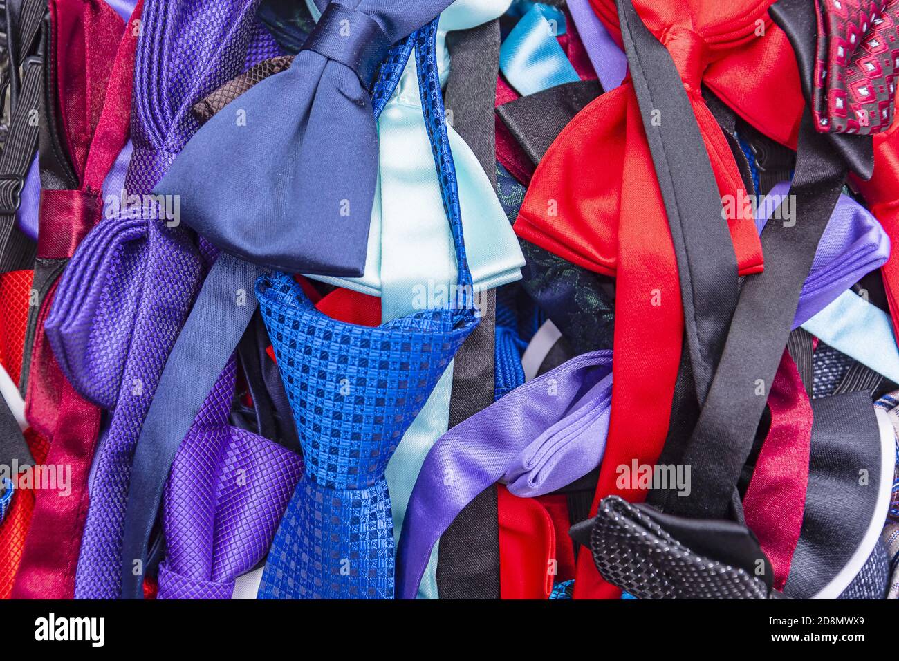 A large pile of mixed-up multi-colored men's ties Stock Photo - Alamy