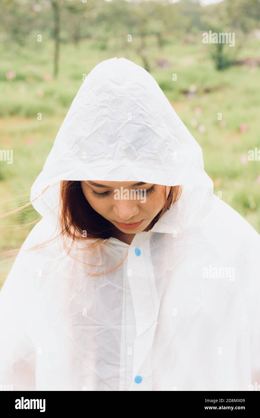 close up woman wear raincoat stand in the rainforest Stock Photo - Alamy