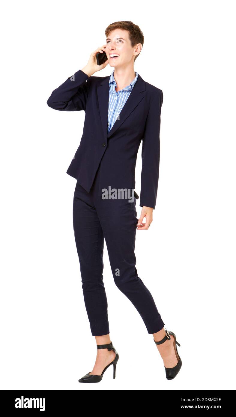 Full body portrait of businesswoman in formal suit talking on mobile ...