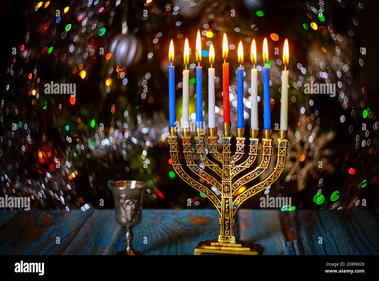 Menorah with burning candles for Hanukkah on sparkle background with ...