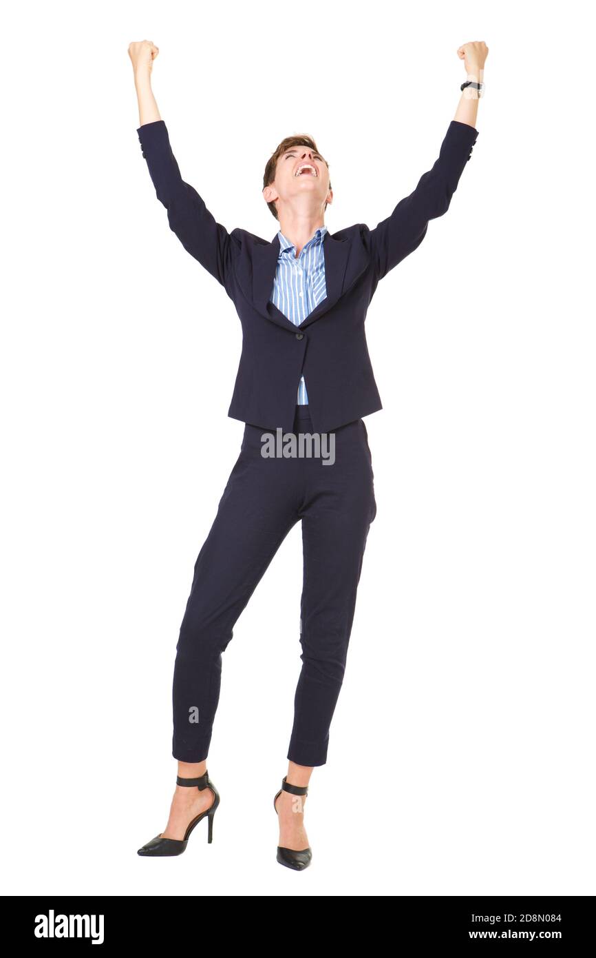 Full length portrait of young businesswoman cheering with arms raised ...