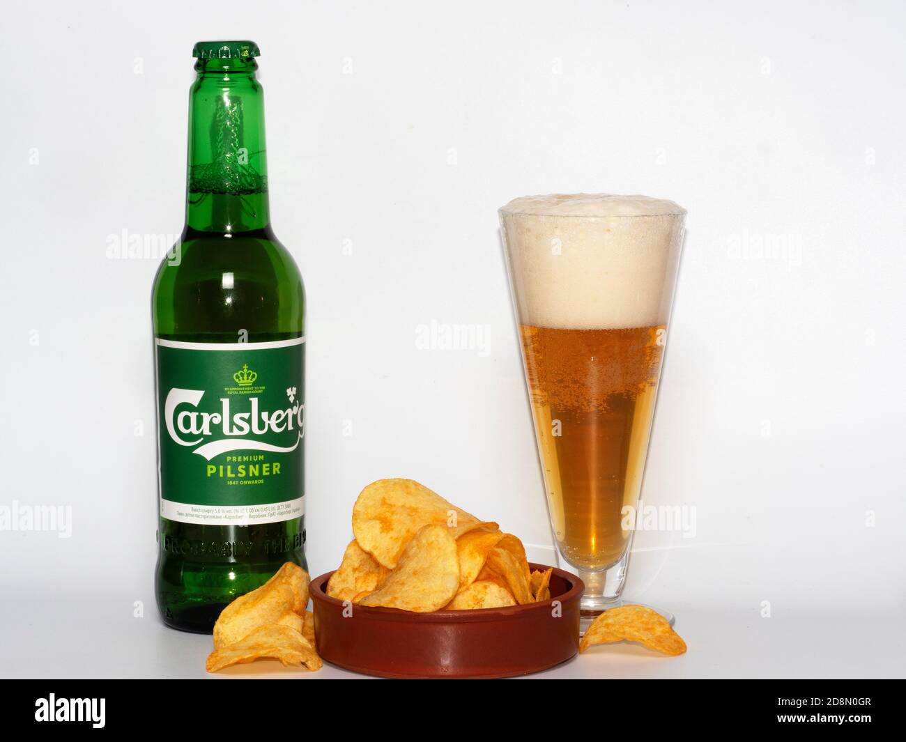 In this photo illustration a bottle of Carlsberg Premium Pilsner beer ...