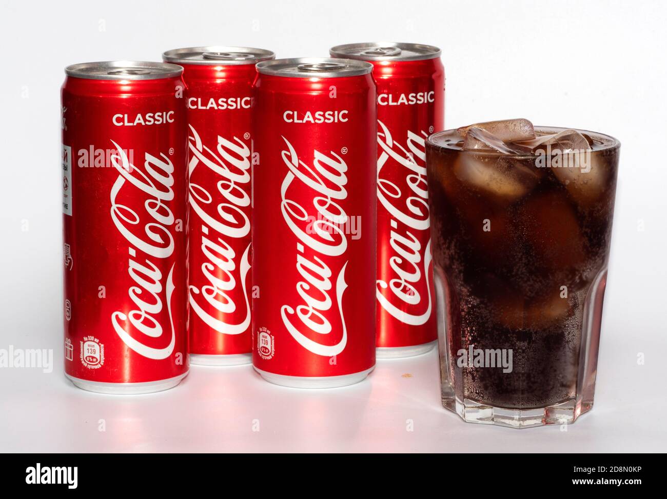 In this photo illustration Coca-Cola cans and glass with ice and cola ...