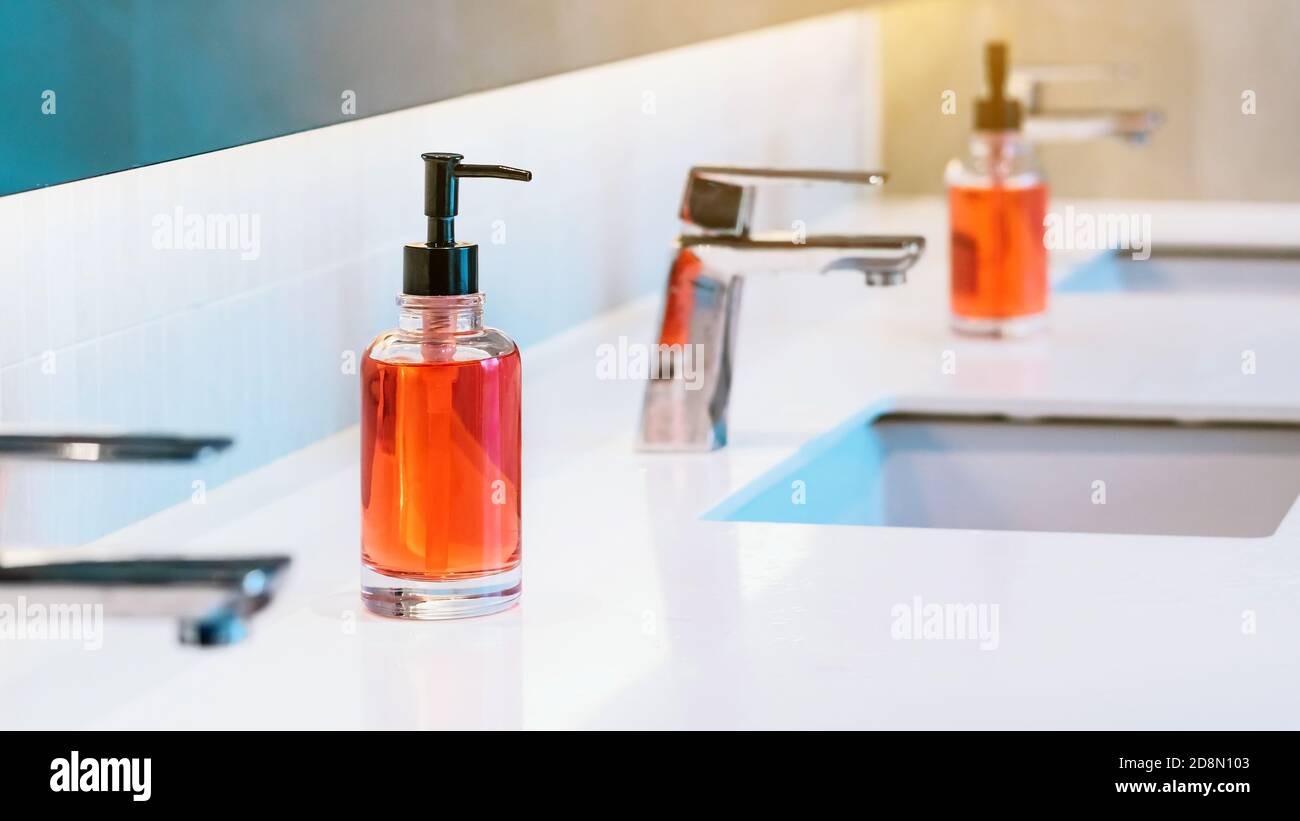 Orange sanitary liquid soap or antivirus soap sanitizer for hand ...