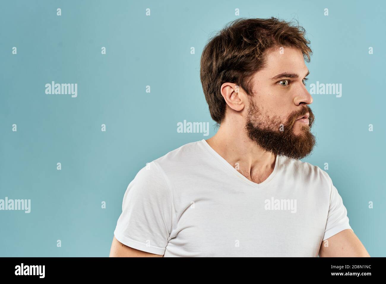 Bearded man emotions facial expression gestures hands close-up blue ...