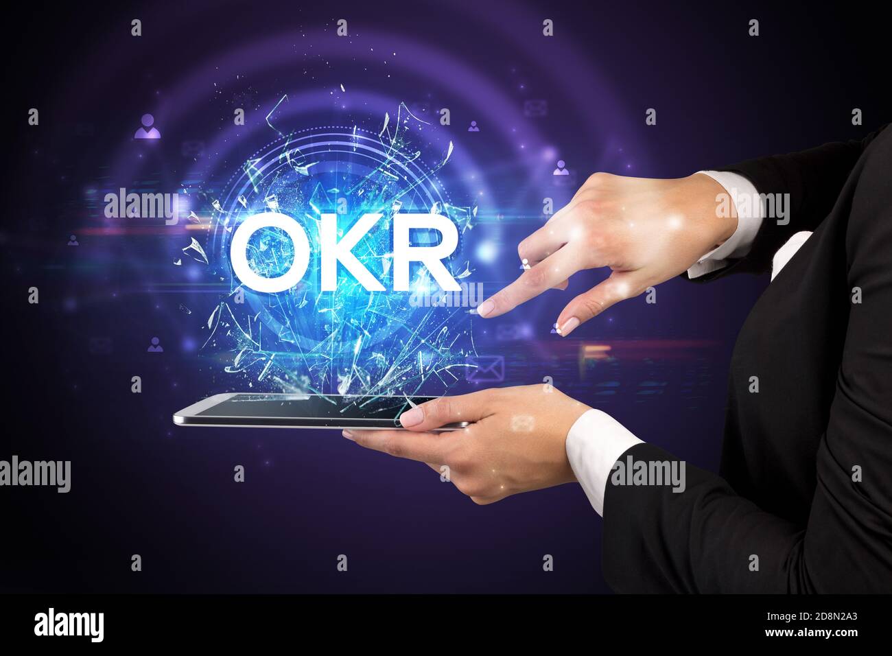 Close-up of a touchscreen with OKR abbreviation, modern technology ...