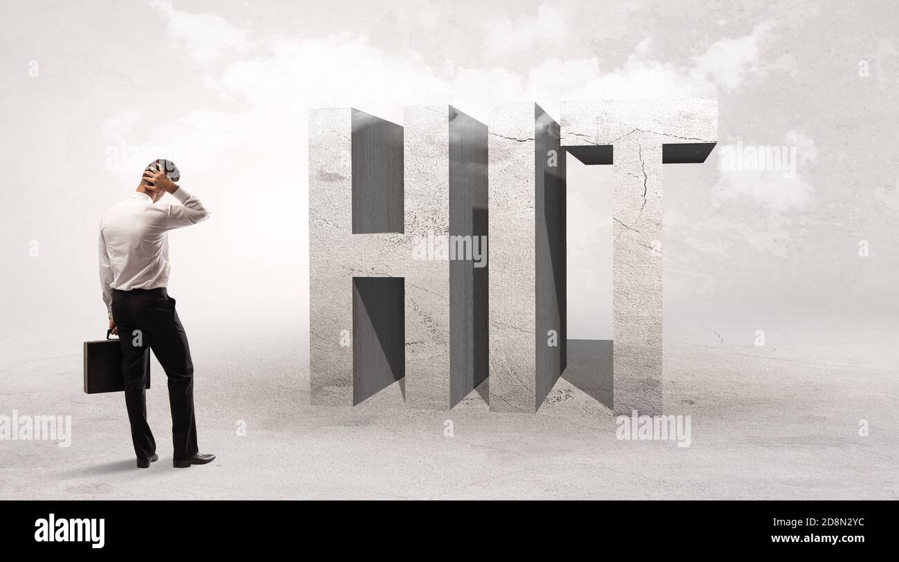 Rear view of a businessman standing in front of HIT abbreviation ...