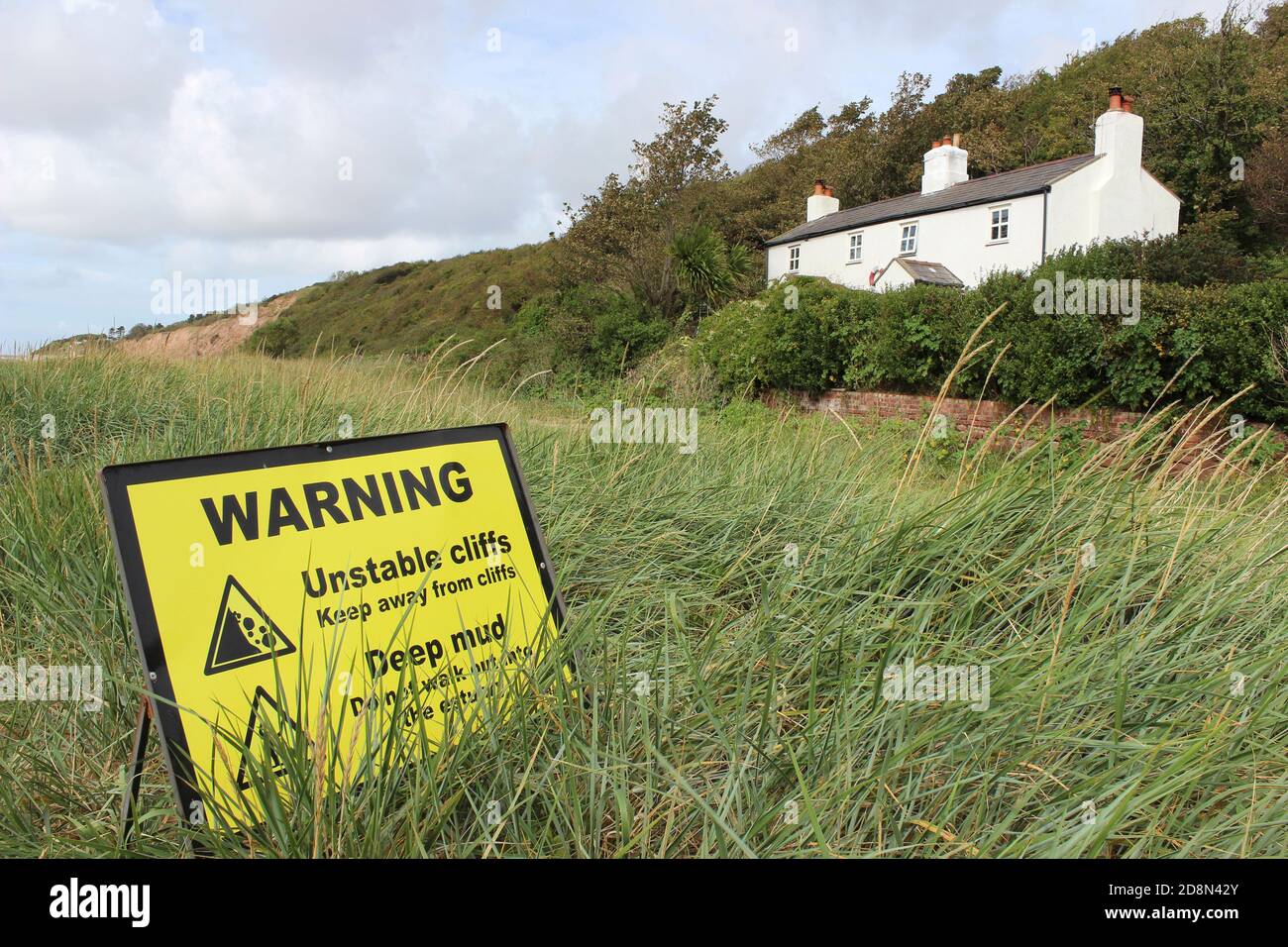 Shore Cottage and Unstable Cliffs Warning Sign, Thurstaston, Wirral, UK ...