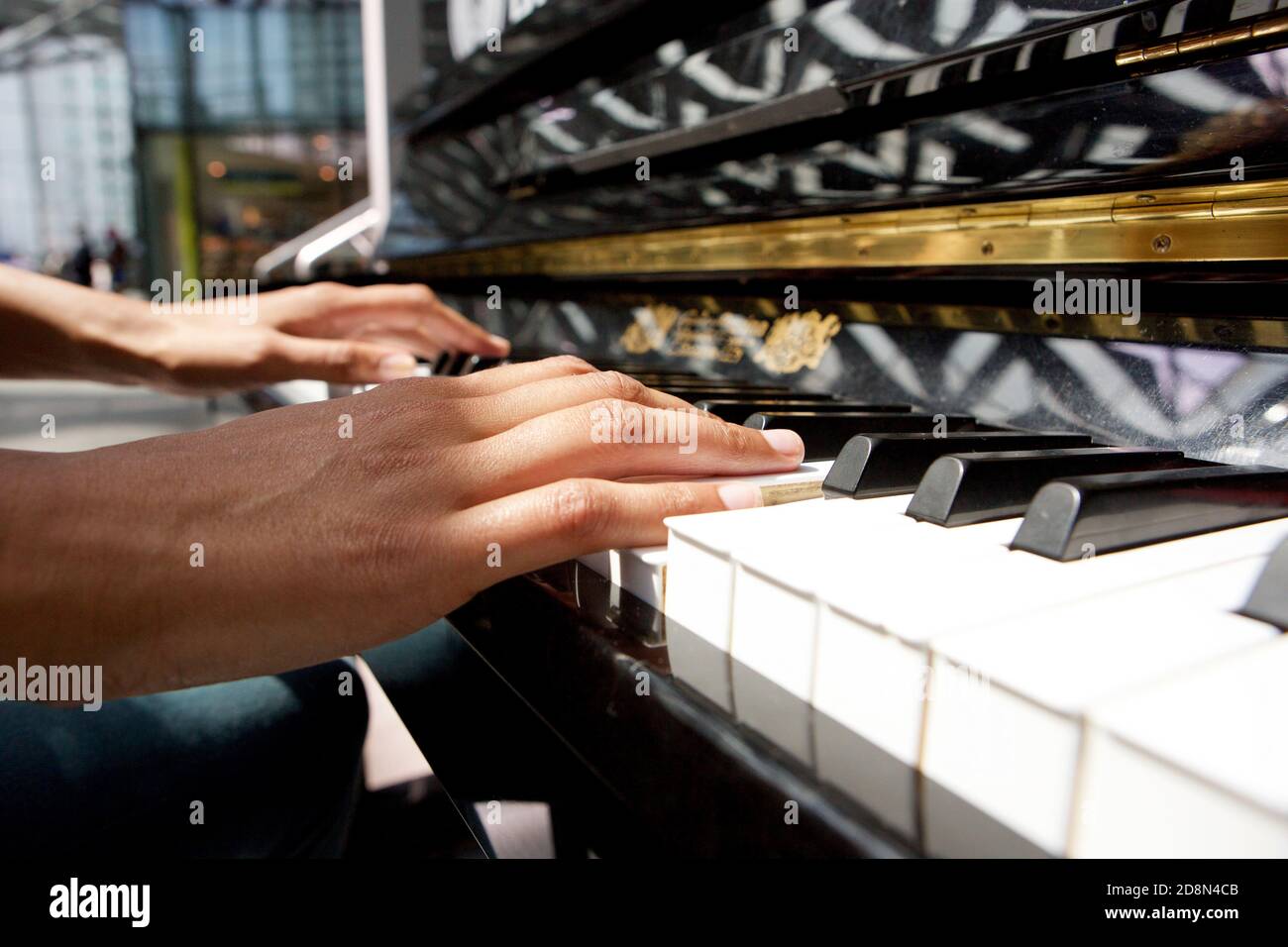 Side view young woman hands playing piano Stock Photo - Alamy