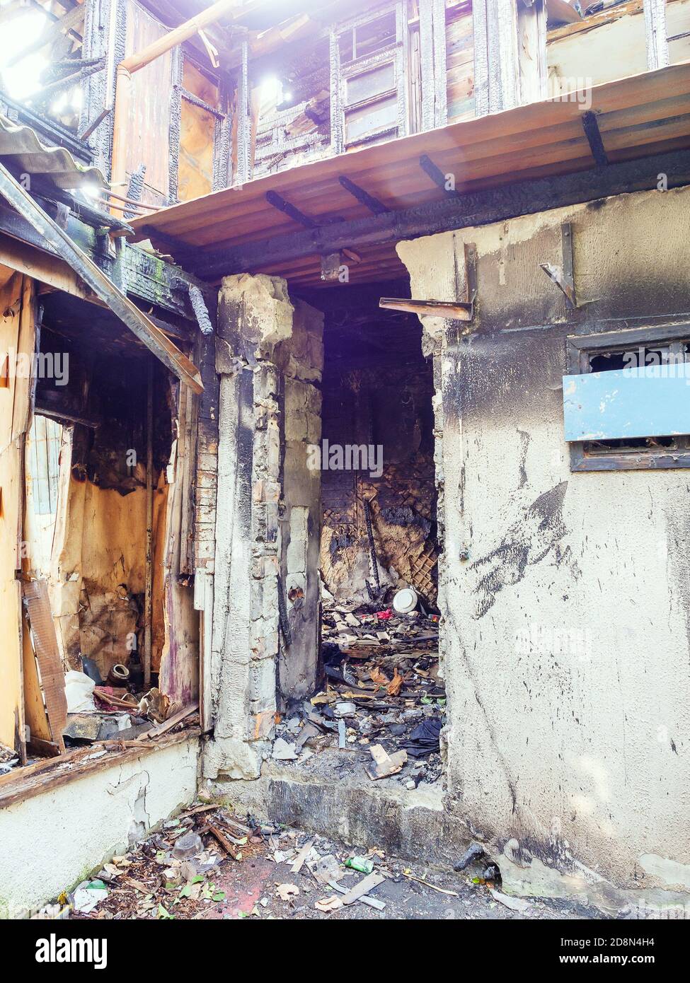Entrance to an old burnt ruined house with a bunch of rubble and ...
