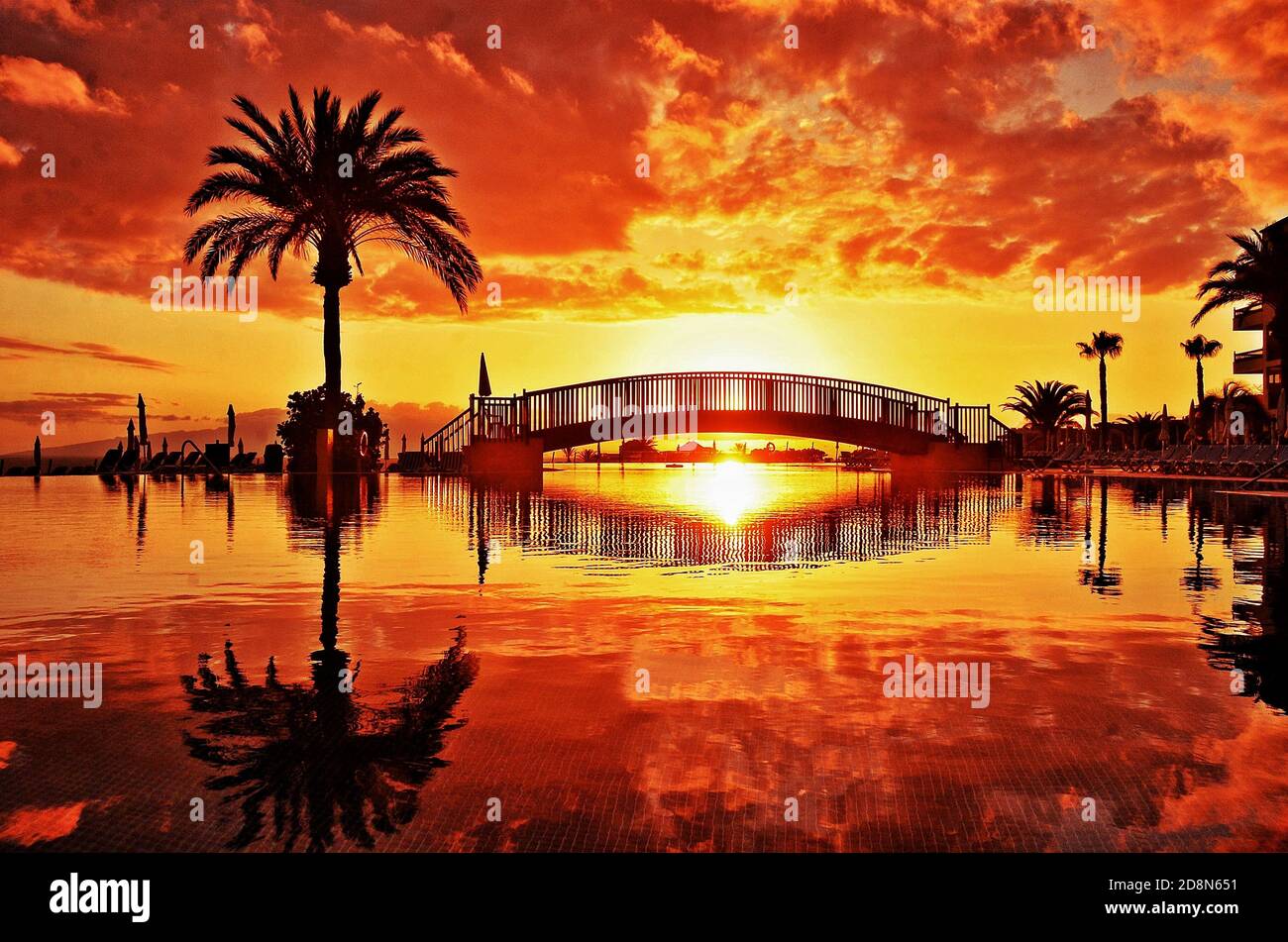 hotel resort pool during sunset time Stock Photo - Alamy