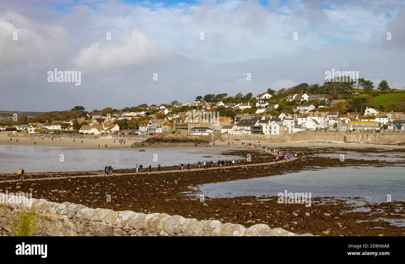 Looking at people crossing the causeway to Saint Michaels Mount in ...