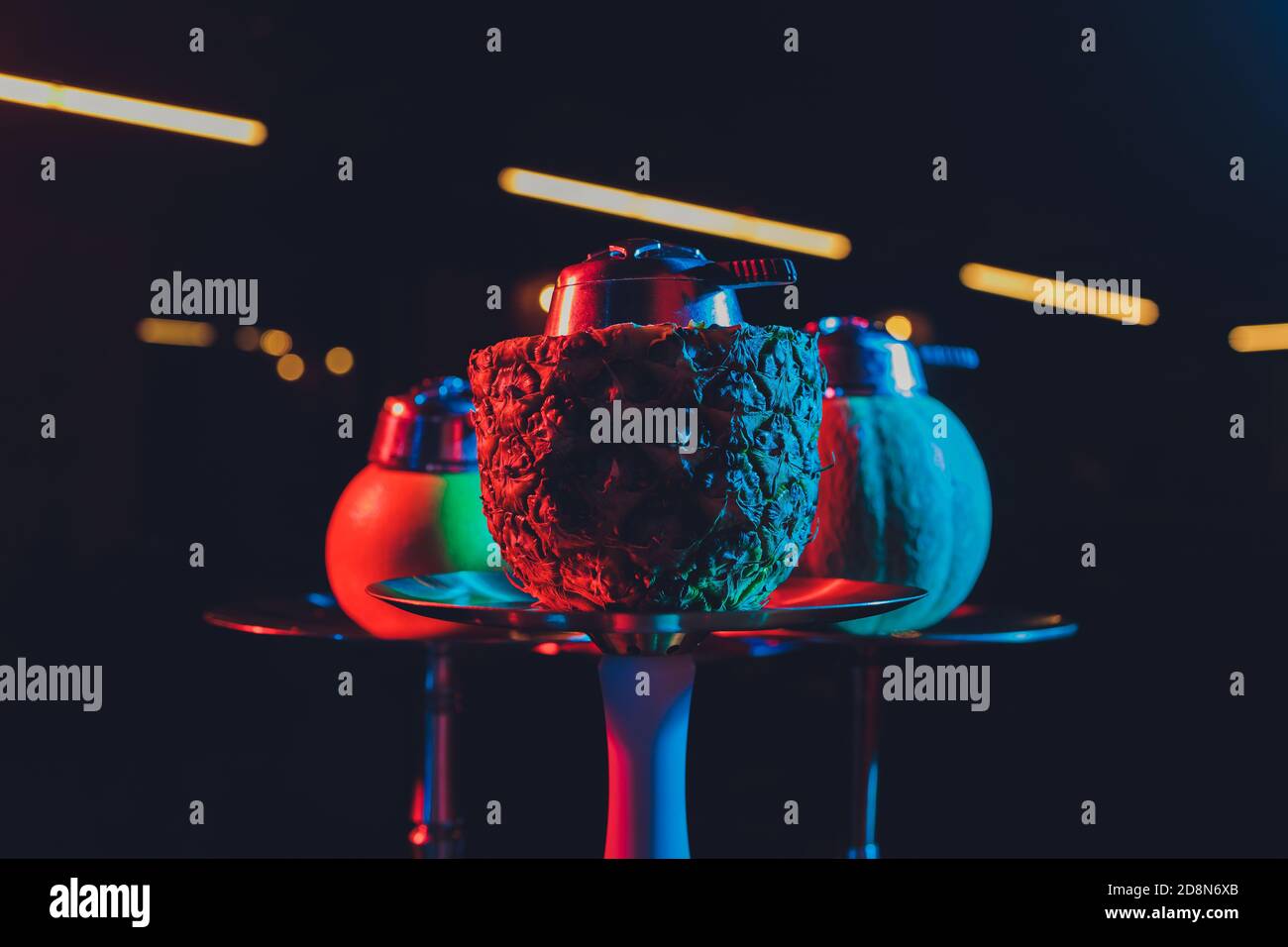 Red shisha hookah with smoke and red sparks on wood table brick, art ...