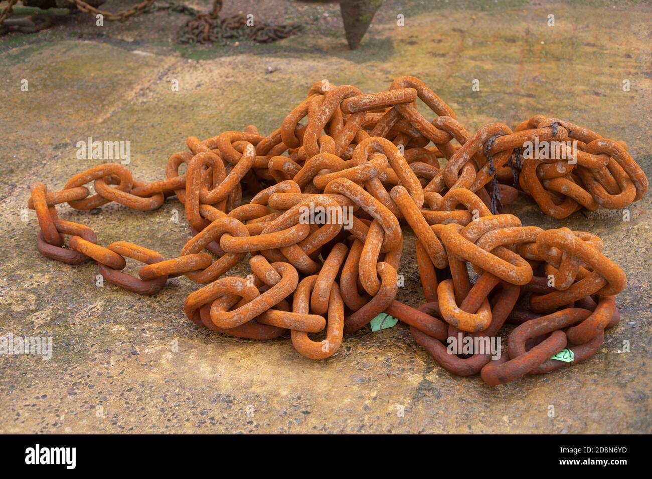 Massive ships chains form long ago covered in rust Stock Photo - Alamy