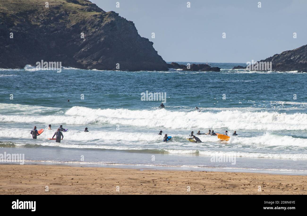 Surfers in the waves at Newquay Cornwall Stock Photo - Alamy