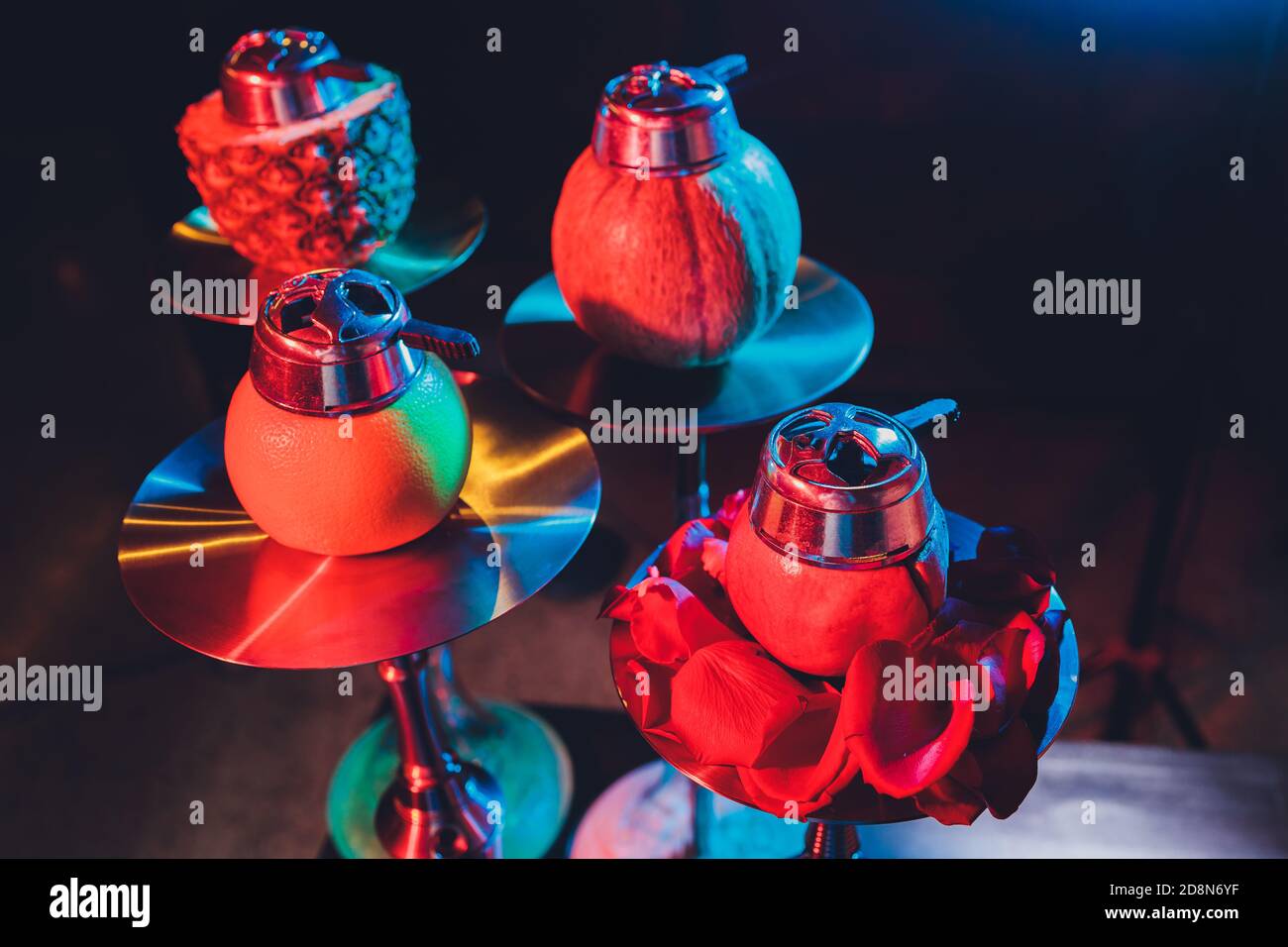 Red shisha hookah with smoke and red sparks on wood table brick, art ...