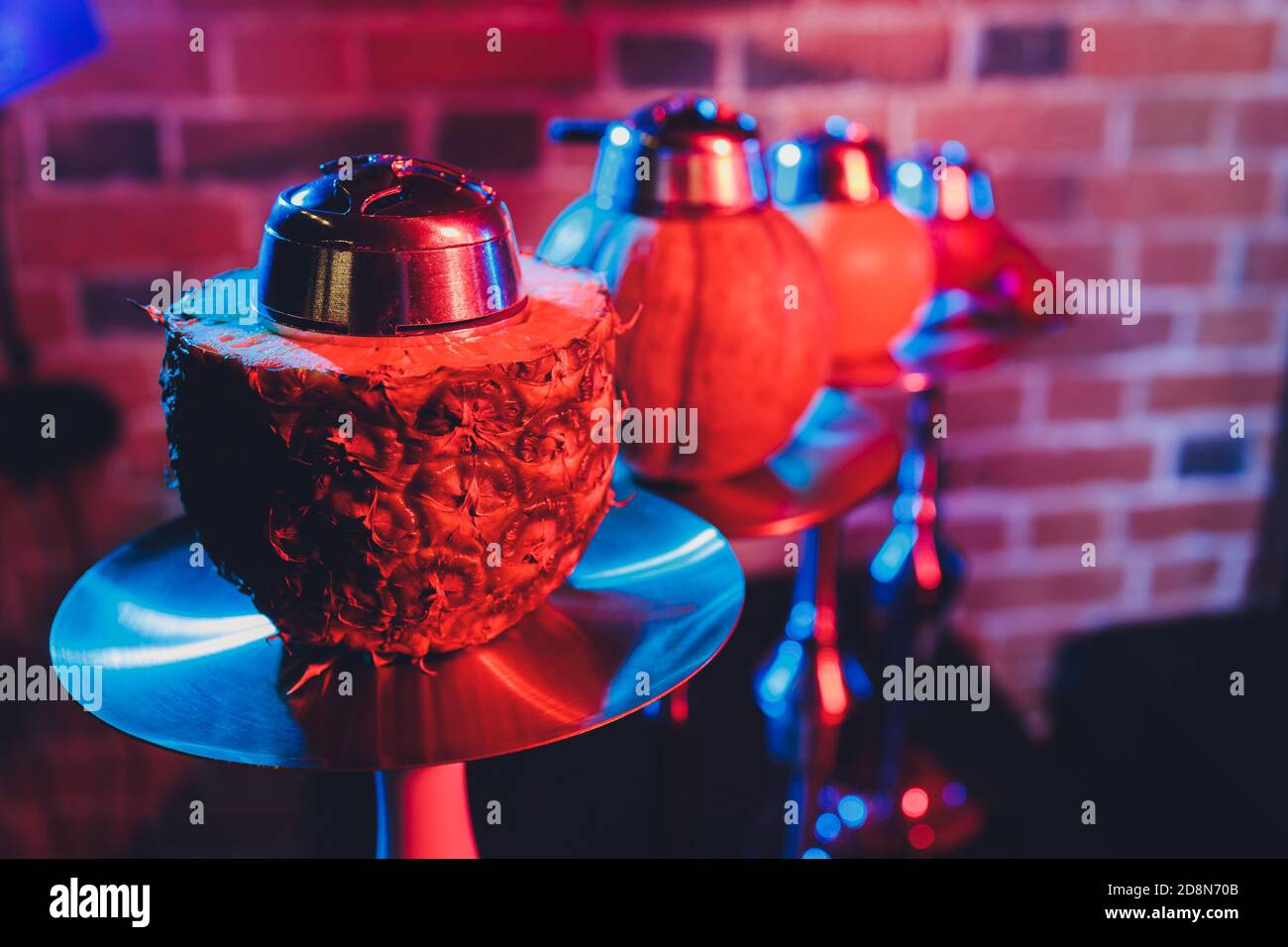 Red shisha hookah with smoke and red sparks on wood table brick, art ...