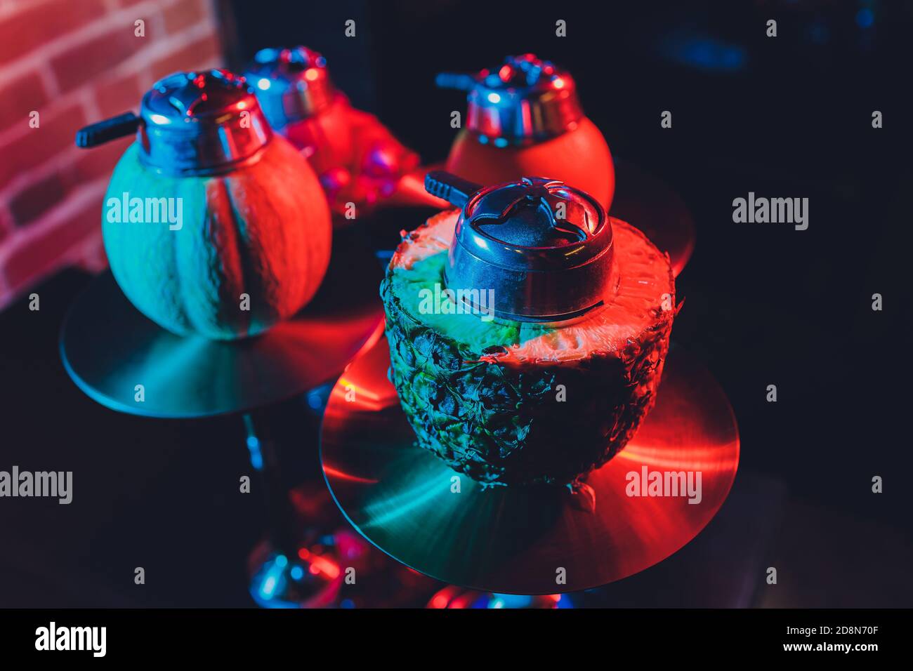 Red shisha hookah with smoke and red sparks on wood table brick, art ...