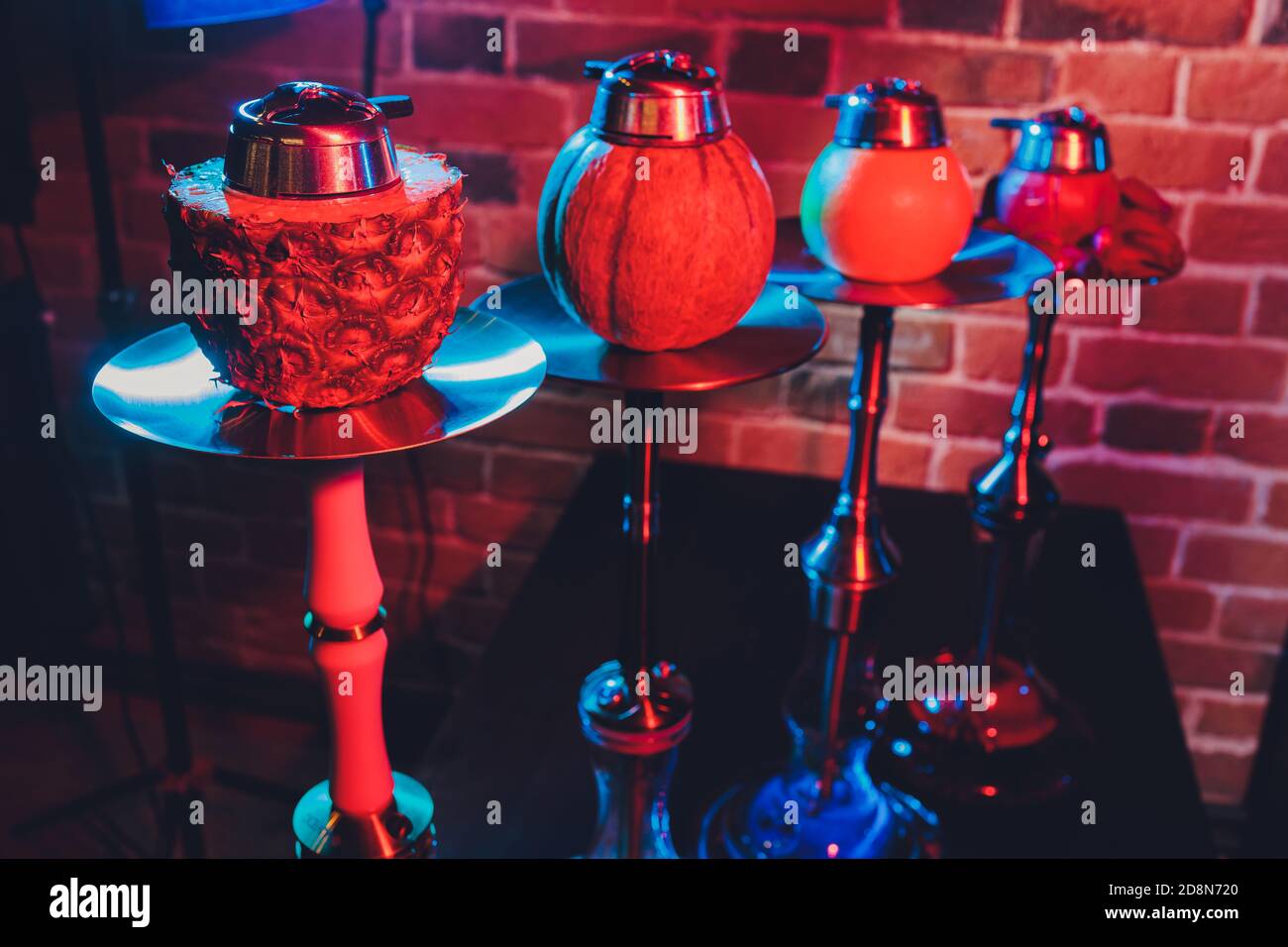 Red shisha hookah with smoke and red sparks on wood table brick, art ...