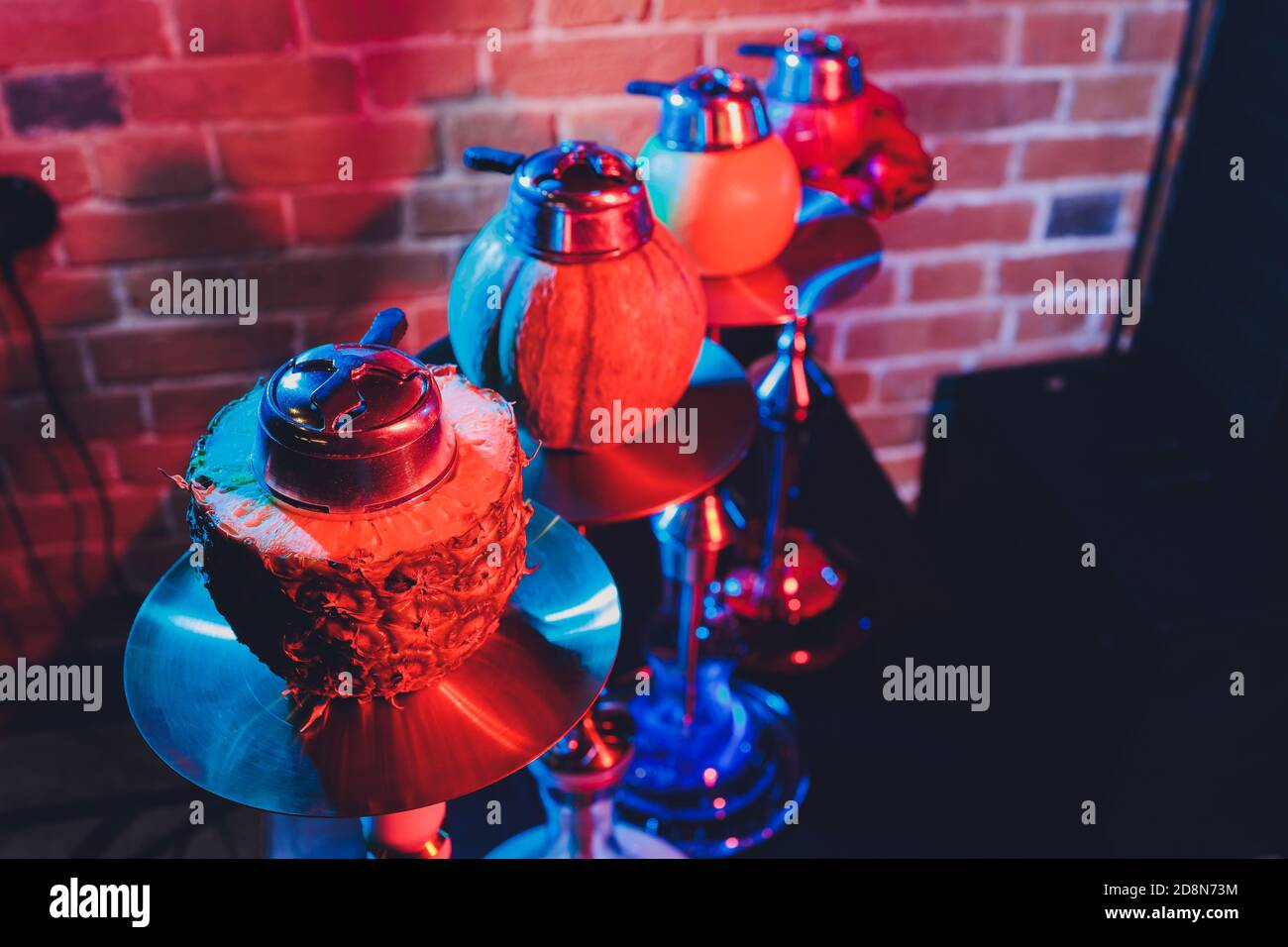 Red shisha hookah with smoke and red sparks on wood table brick, art ...