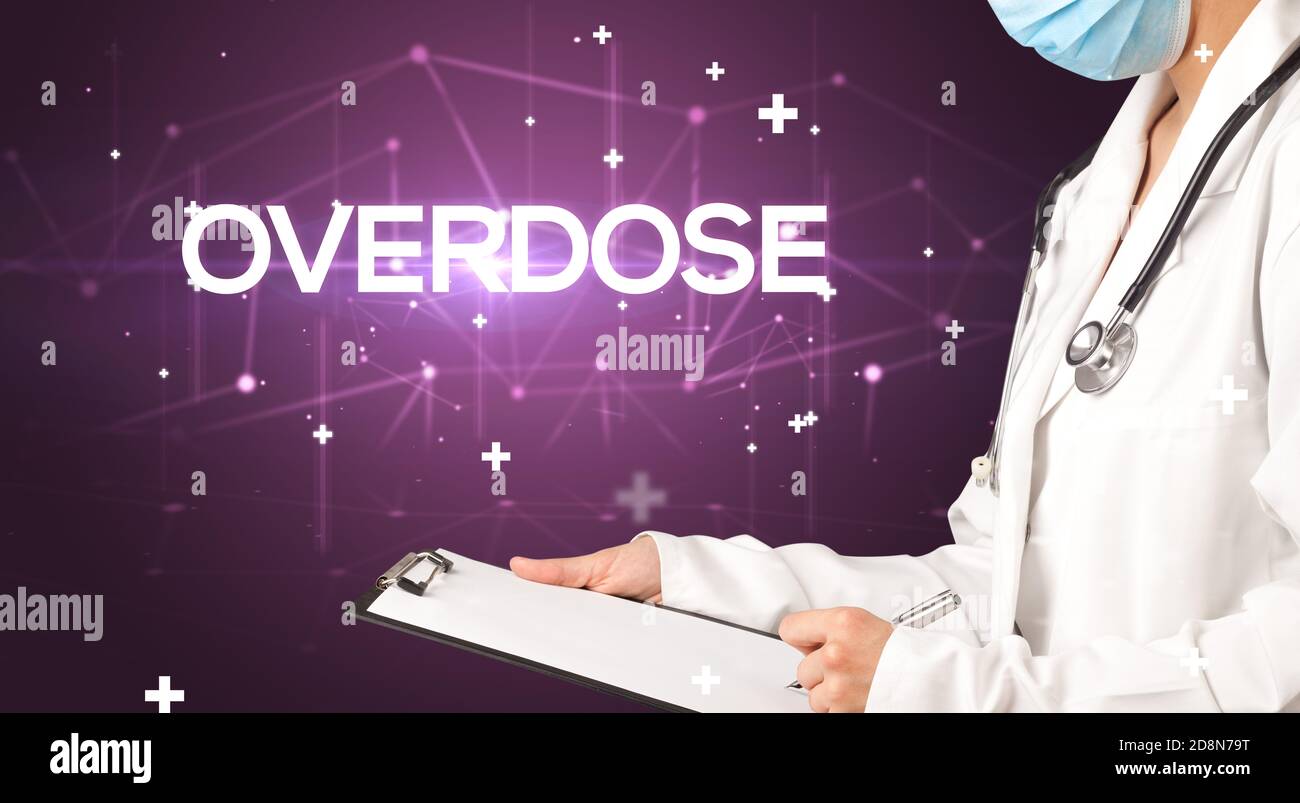 Doctor fills out medical record with OVERDOSE inscription, medical ...