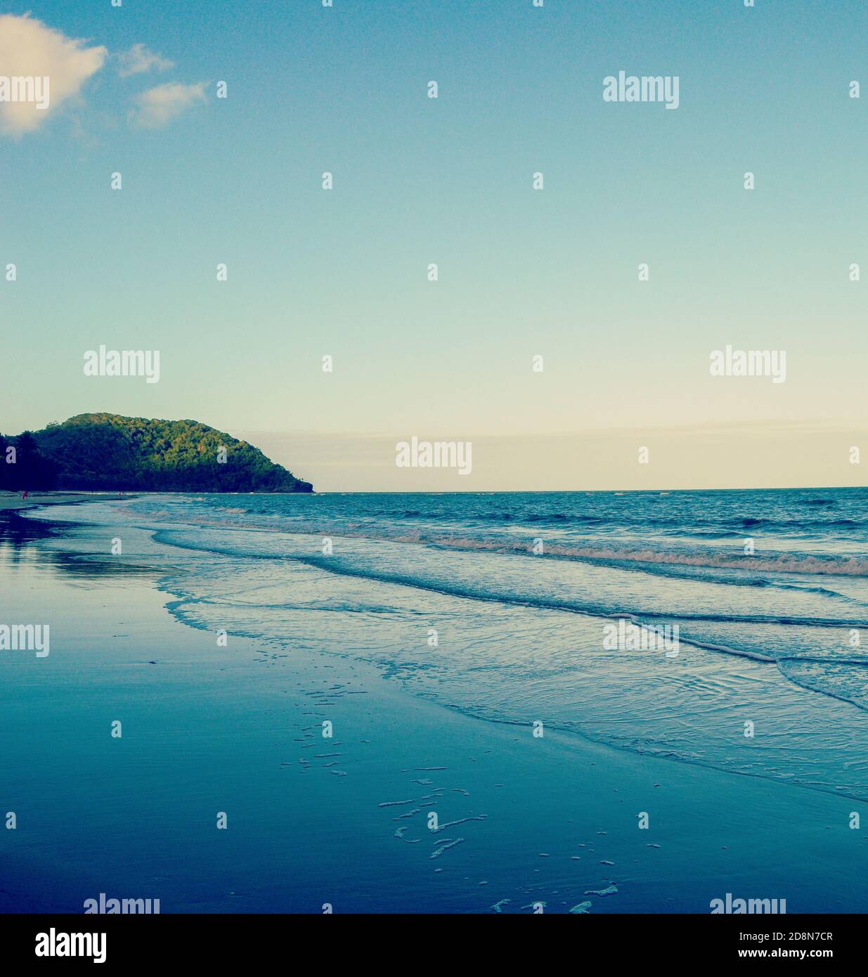 Cape Tribulation Australia, with sandy beach, ocean waves, blue sky ...
