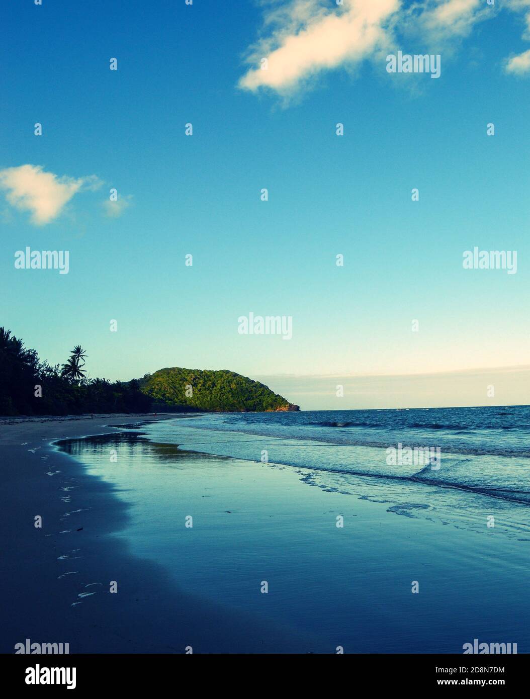 Cape Tribulation Australia, with sandy beach, ocean waves, blue sky ...