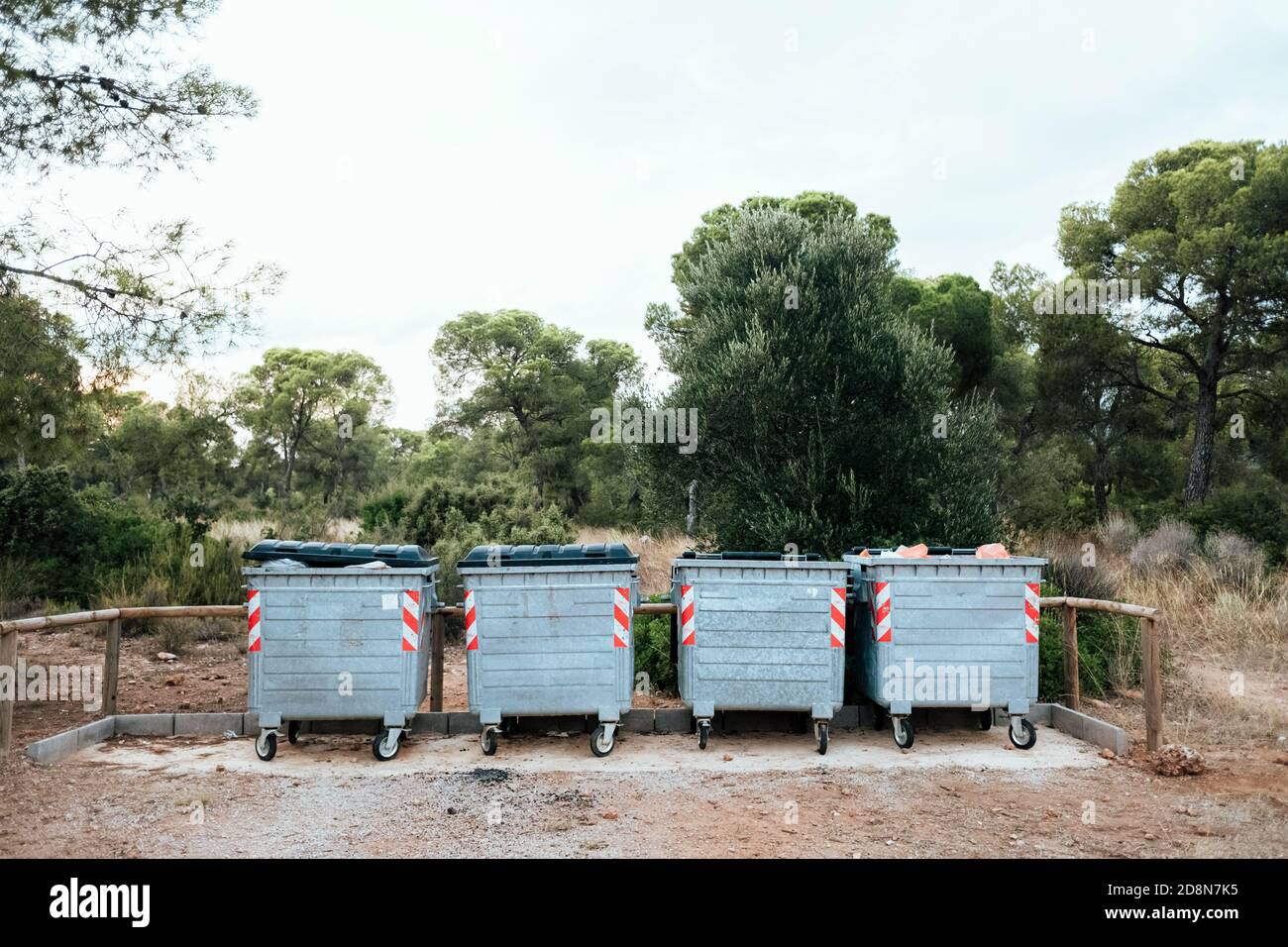 Metal garbage containers for urban waste in a field area Stock Photo ...