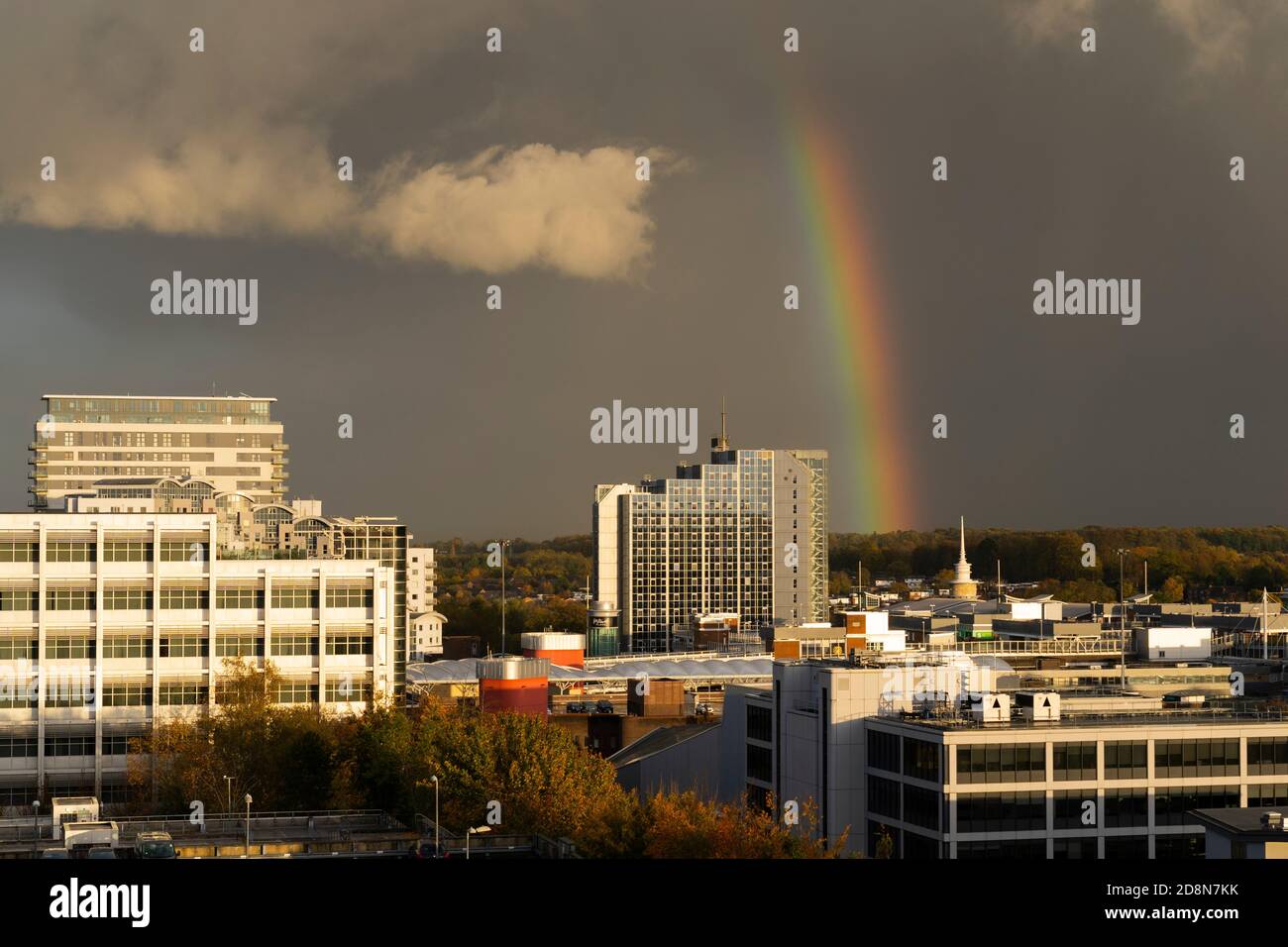 A rainbow in a stormy grey sky above high rise buildings Skyline Plaza ...