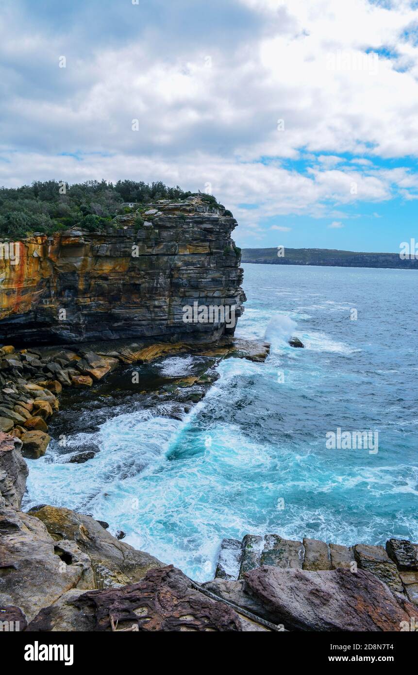 Jagged Rocky Cliffs facing the Sea Stock Photo - Alamy