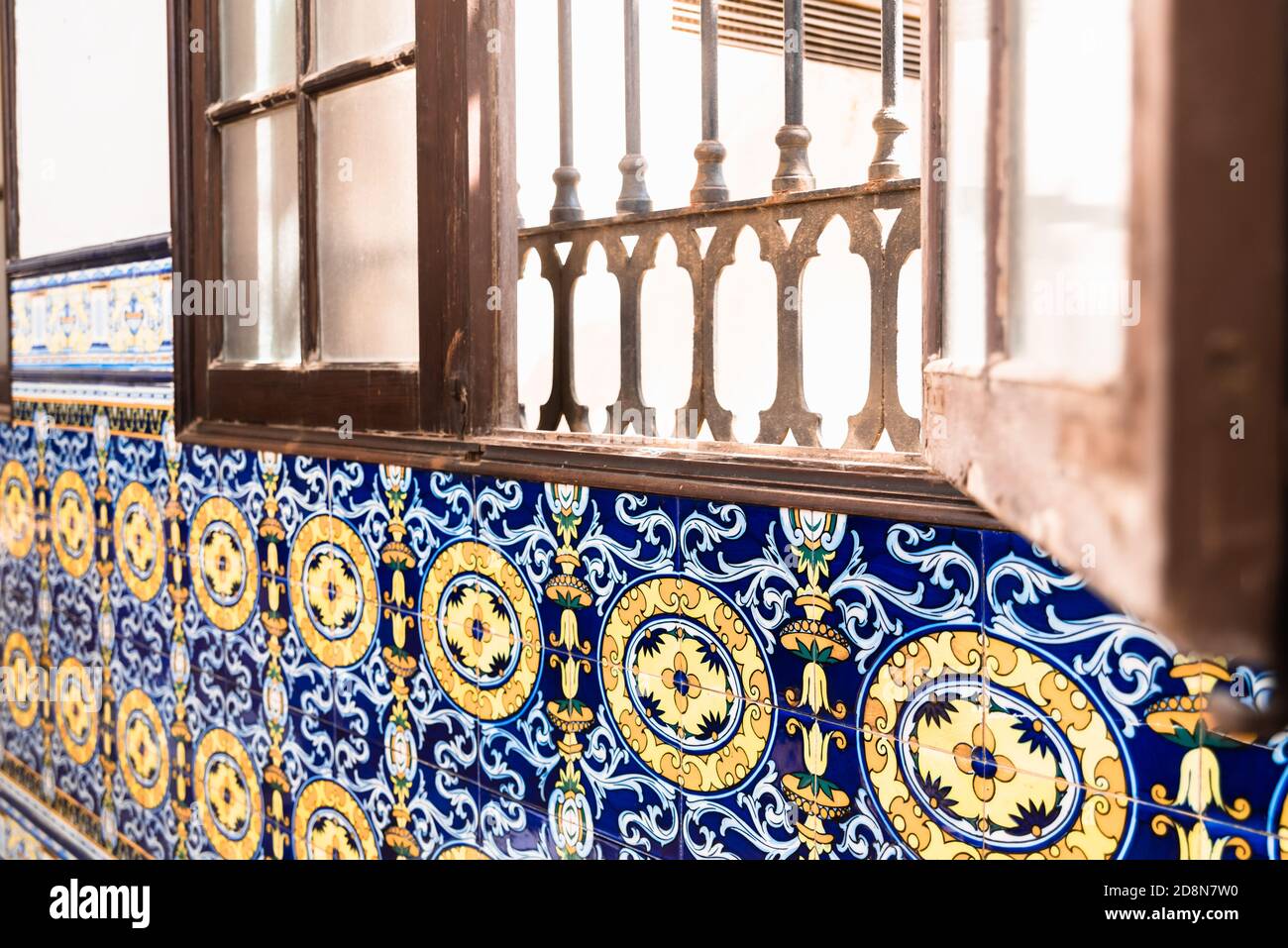 Traditional blue tiles decorate the interior of an interior corridor of ...