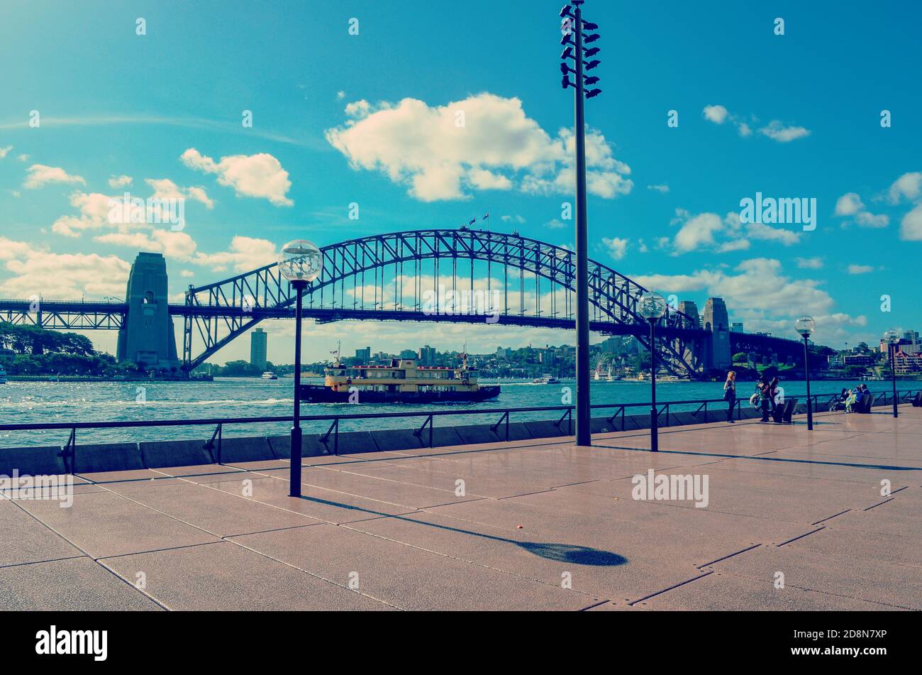Boat passing by the Sydney Harbor Bridge Stock Photo - Alamy