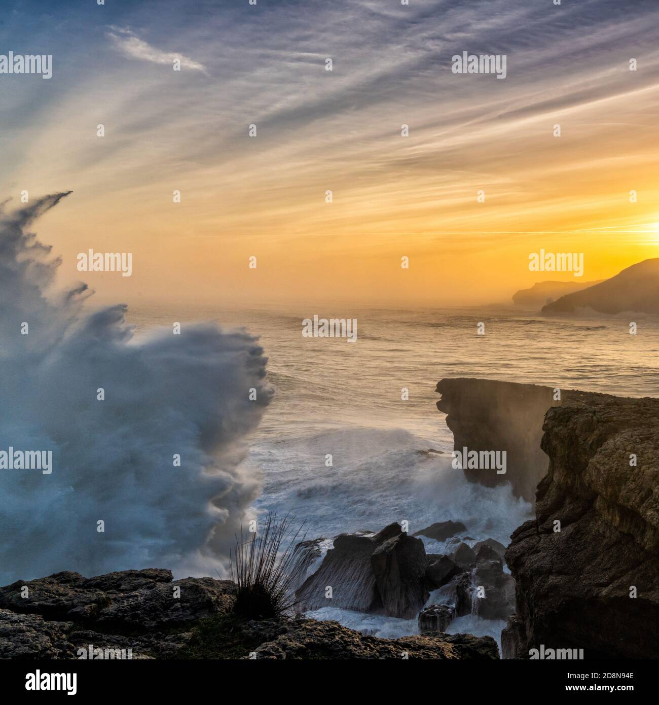 A view of huge storm surge ocean waves crashing onto shore and cliffs ...