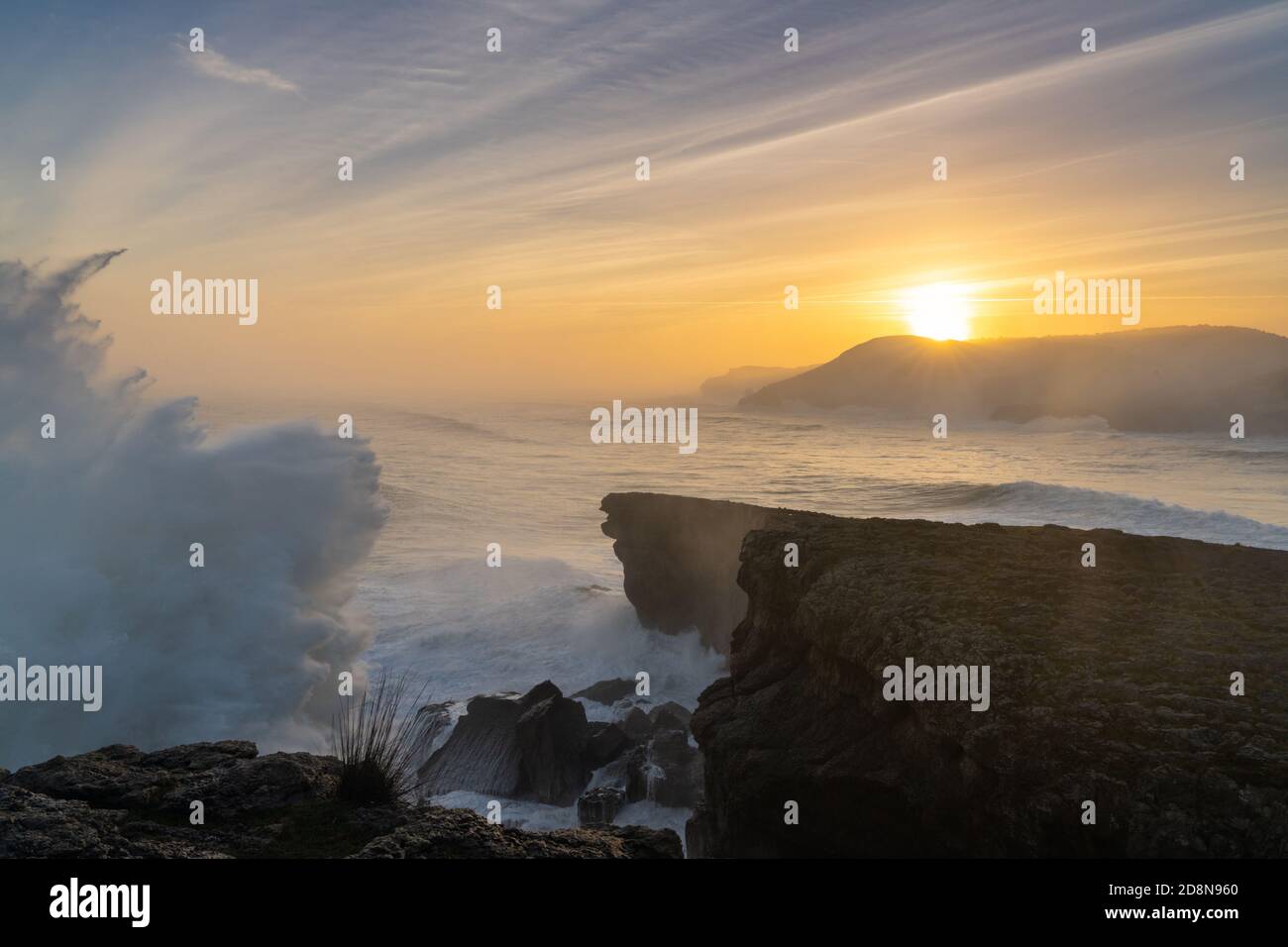 A view of huge storm surge ocean waves crashing onto shore and cliffs ...