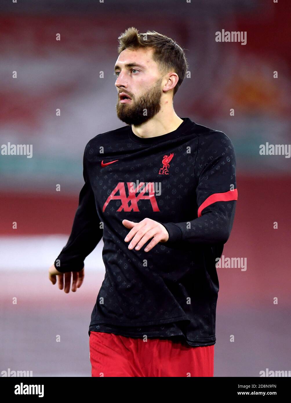 Liverpool's Nathaniel Phillips warms up before the Premier League match ...